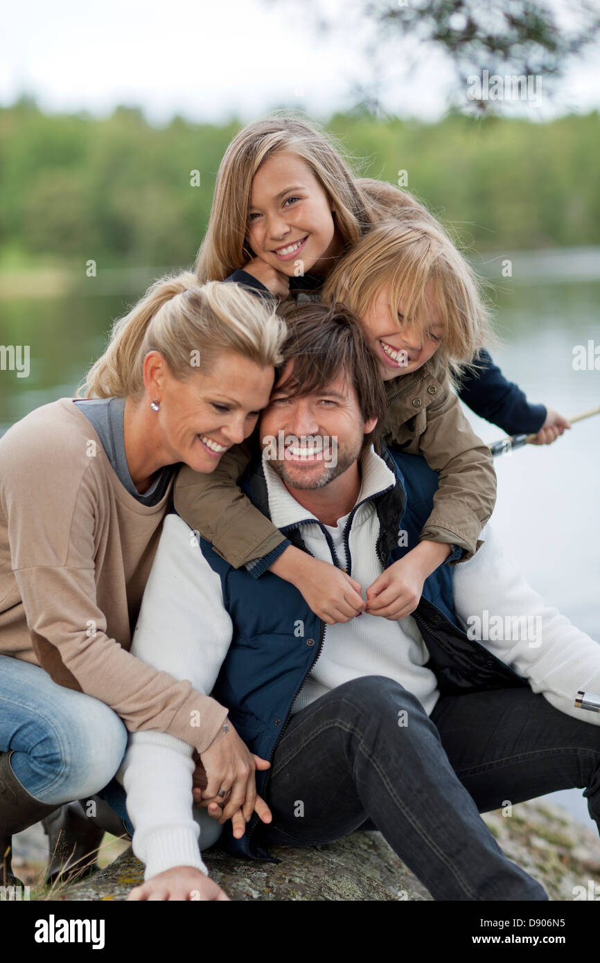 Parents and two children bonding Stock Photo - Alamy