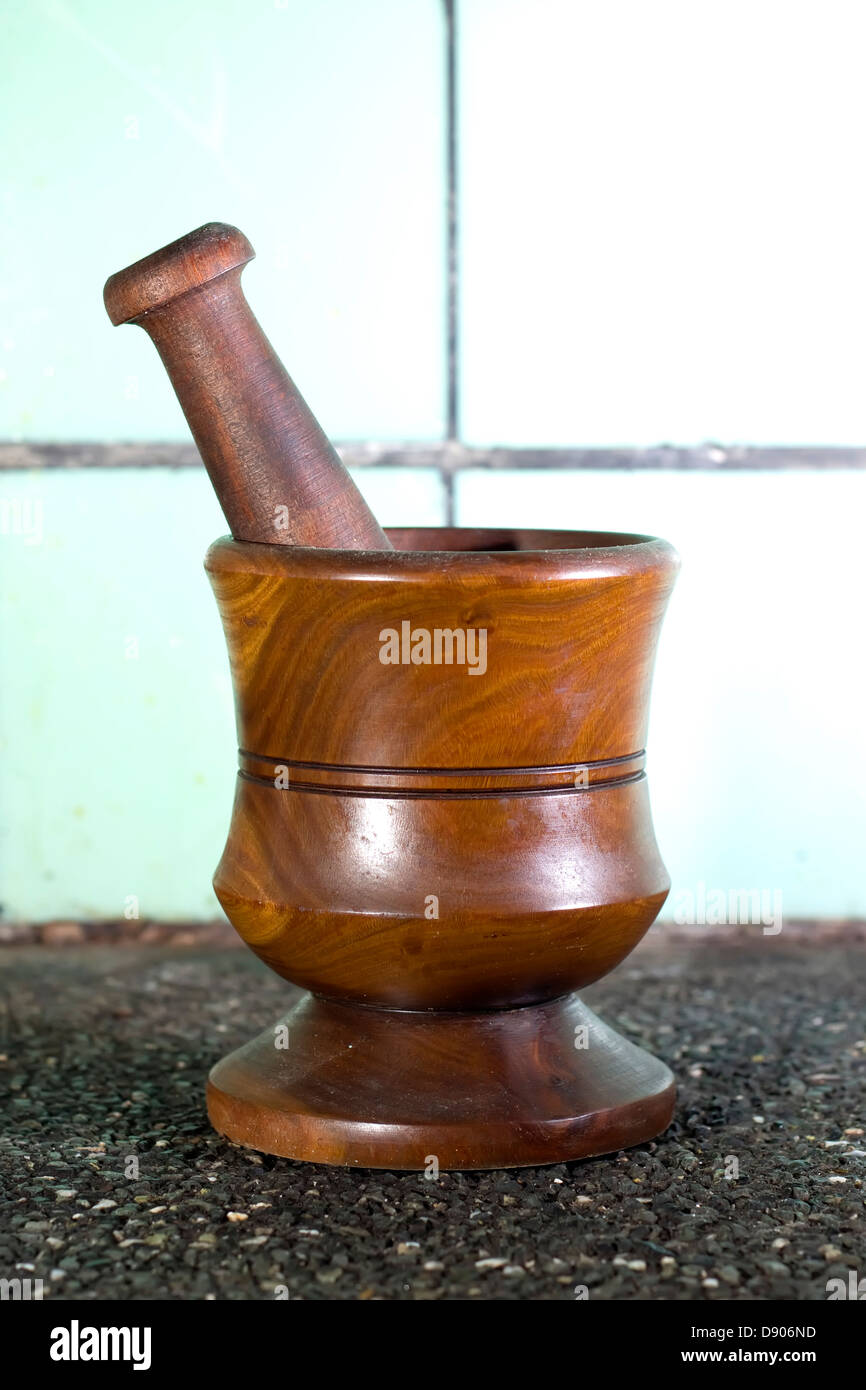 Wooden mortar on kitchen Stock Photo - Alamy
