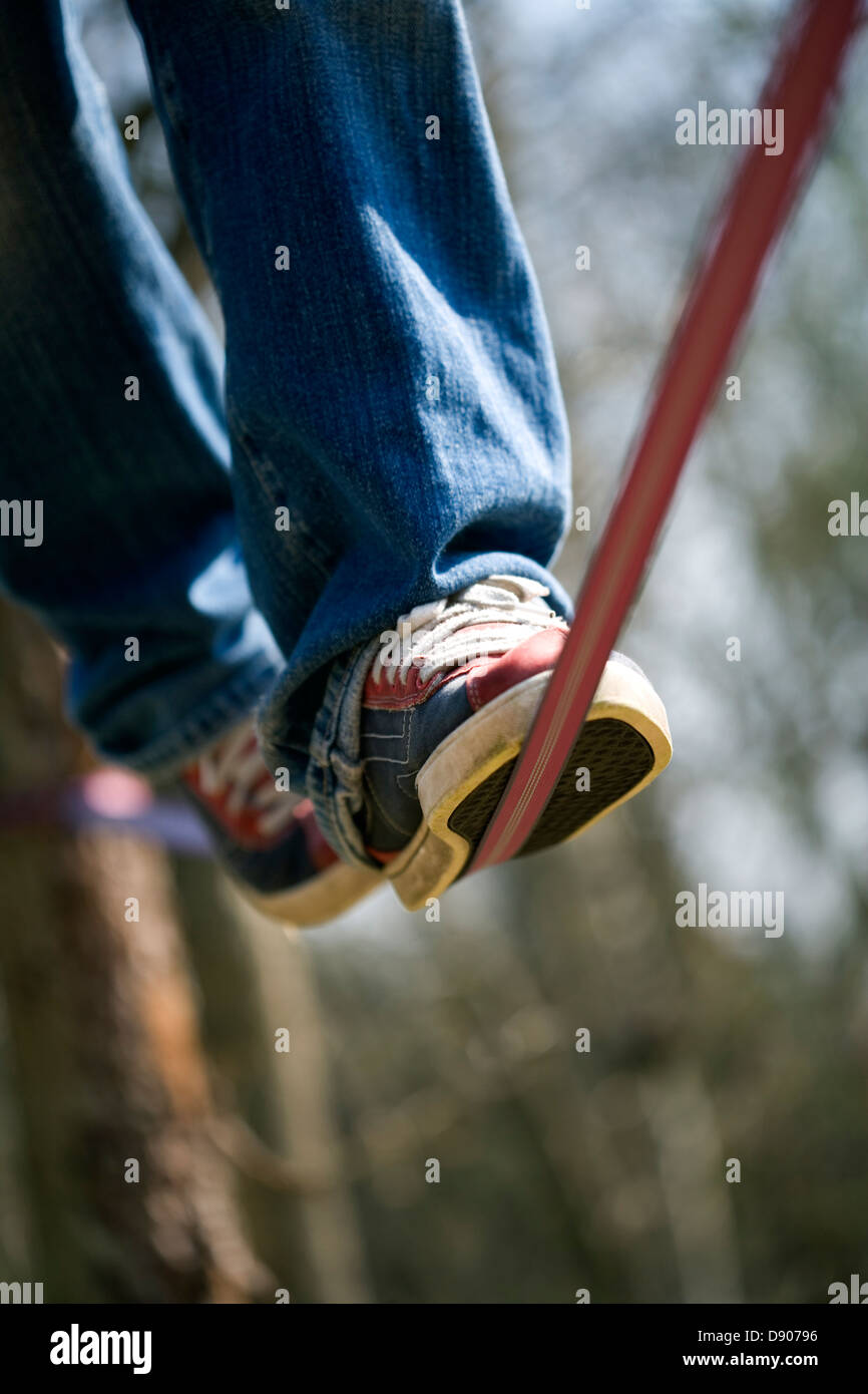 A man balancing on a rope Stock Photo - Alamy