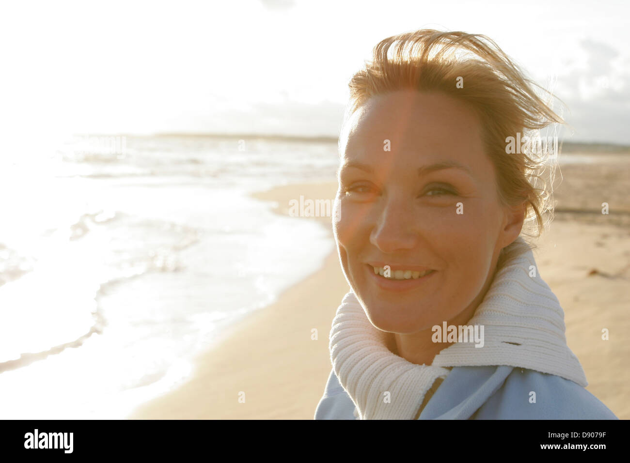 Portrait of a smiling woman outside Stock Photo - Alamy