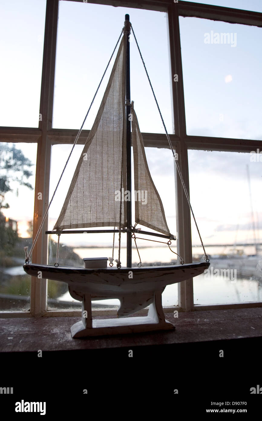 A model of a sailingboat standing in a window Stock Photo - Alamy