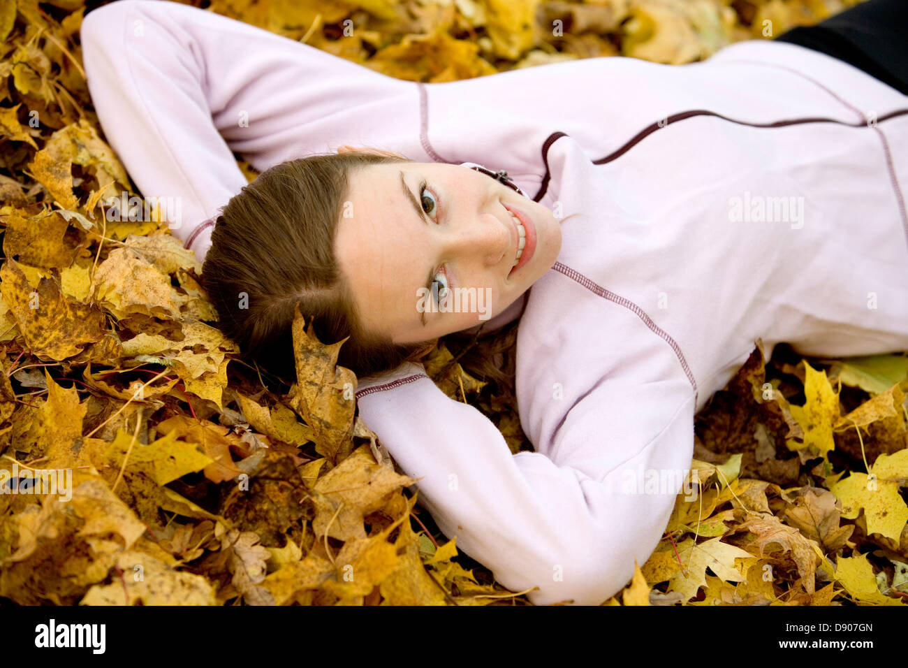Laying down woman autumn hi-res stock photography and images - Alamy