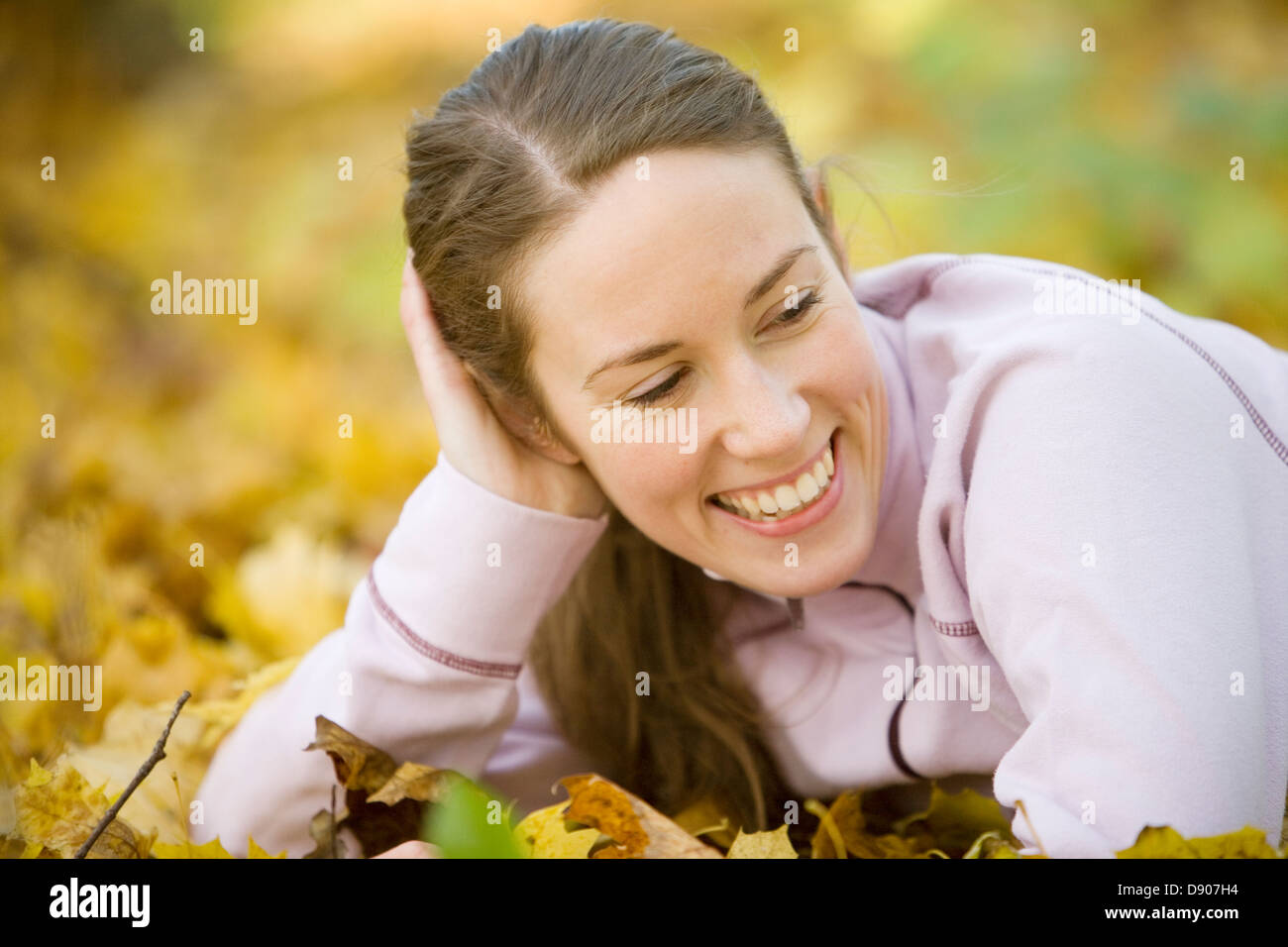Woman laying on ground hi-res stock photography and images - Alamy