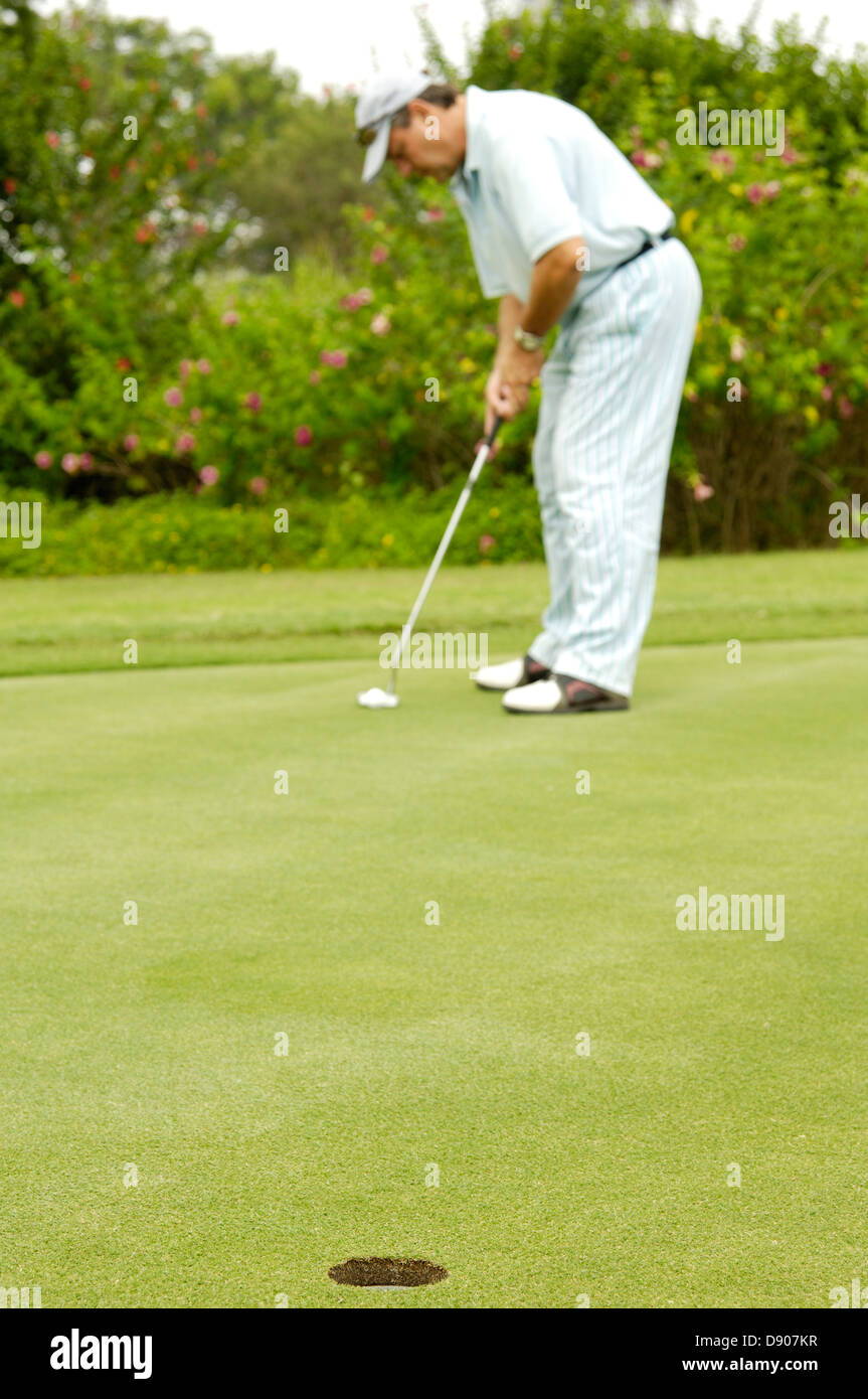 A man playing golf Stock Photo - Alamy