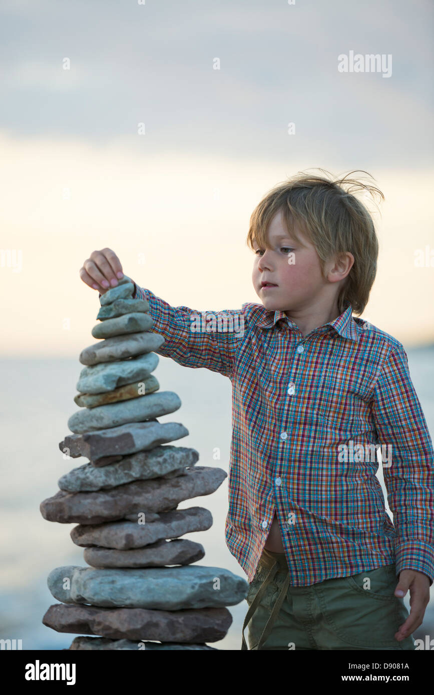 Standing on pile rocks beach hi-res stock photography and images - Alamy