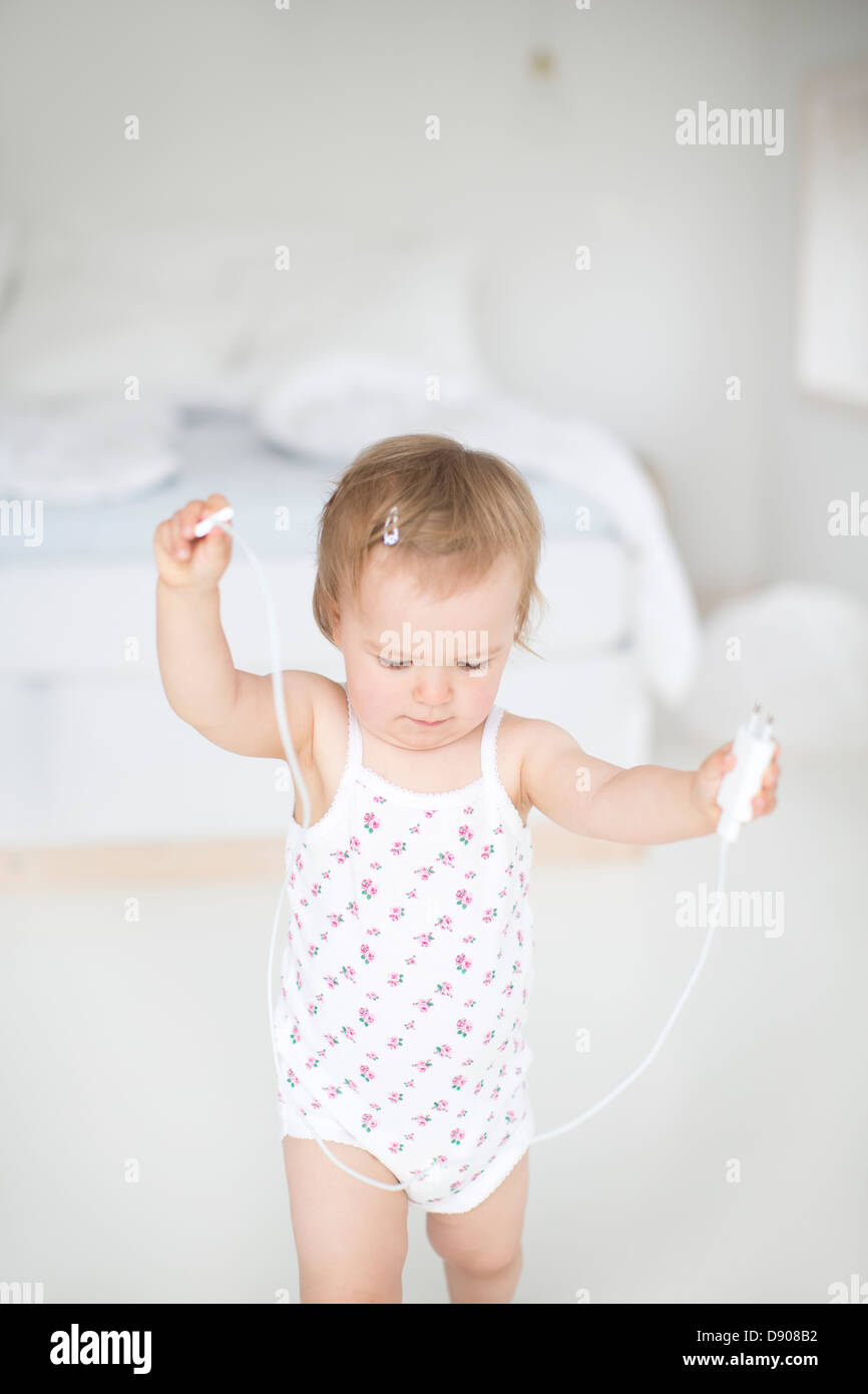 Little girl playing with string Stock Photo - Alamy