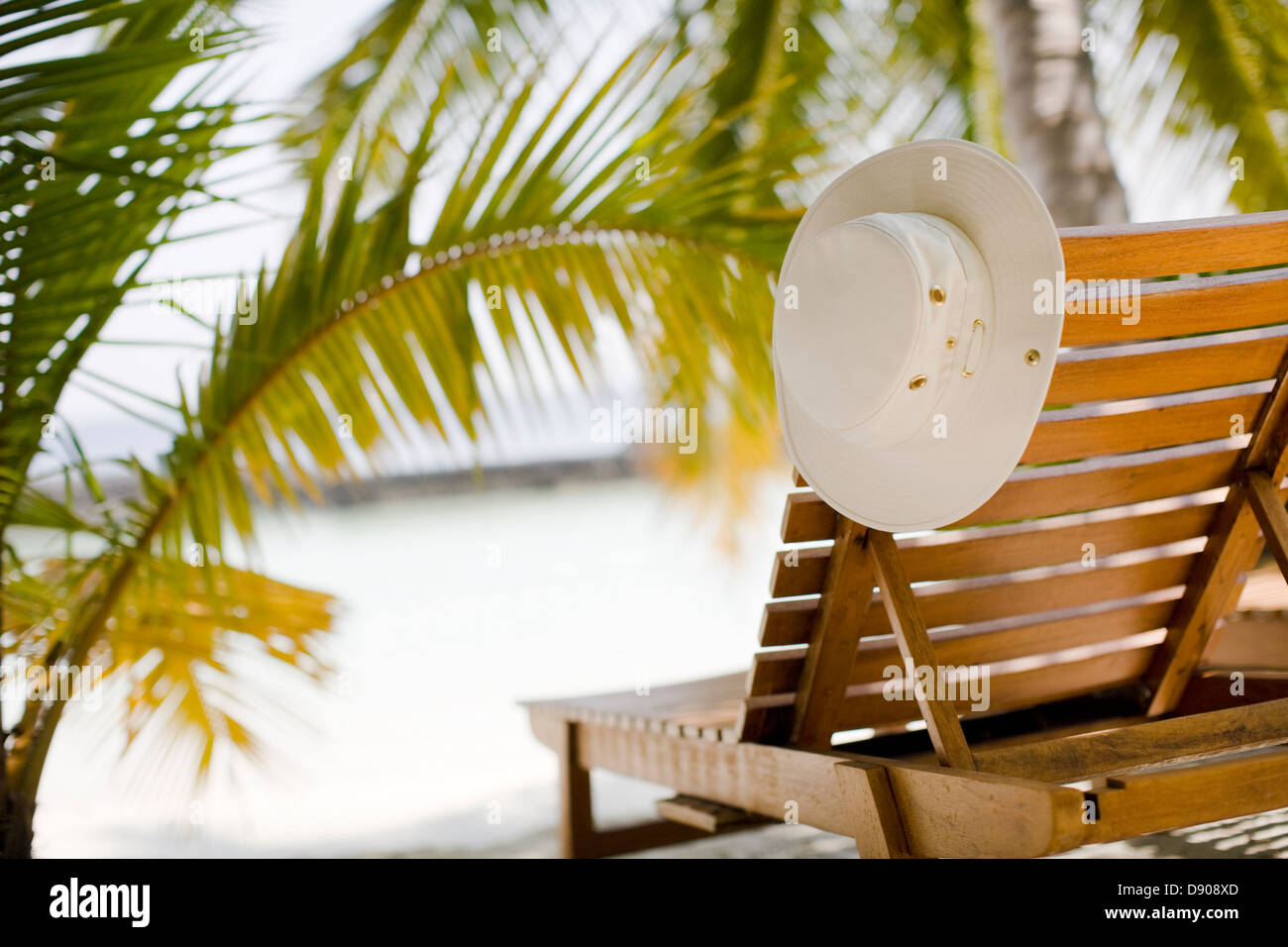 A sun hat hanging on a sun chair, the Maldives Stock Photo - Alamy