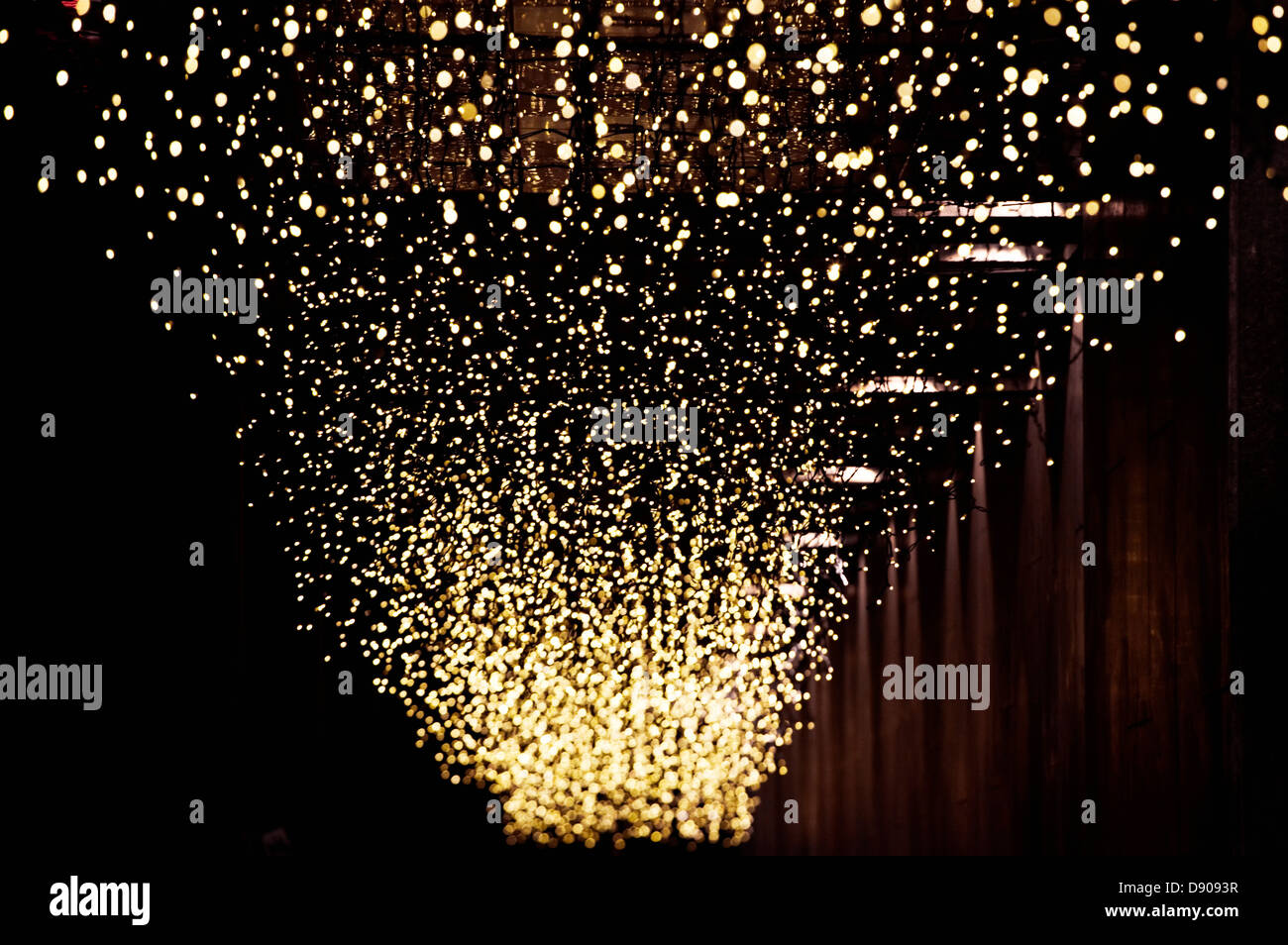 Strands of light from illuminated spotlight on stage Stock Photo - Alamy