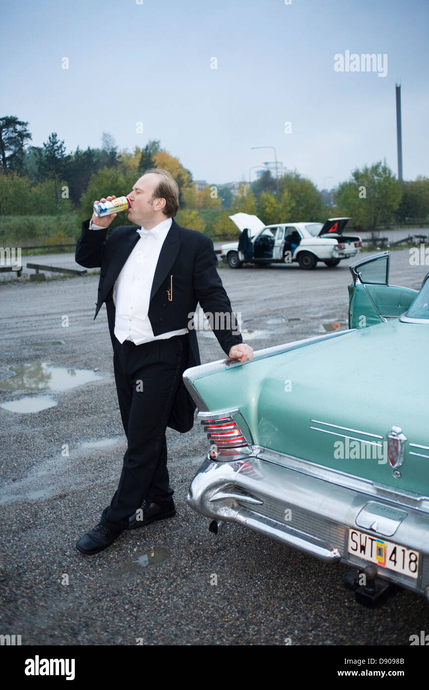 A bride groom drinking beer Stock Photo - Alamy