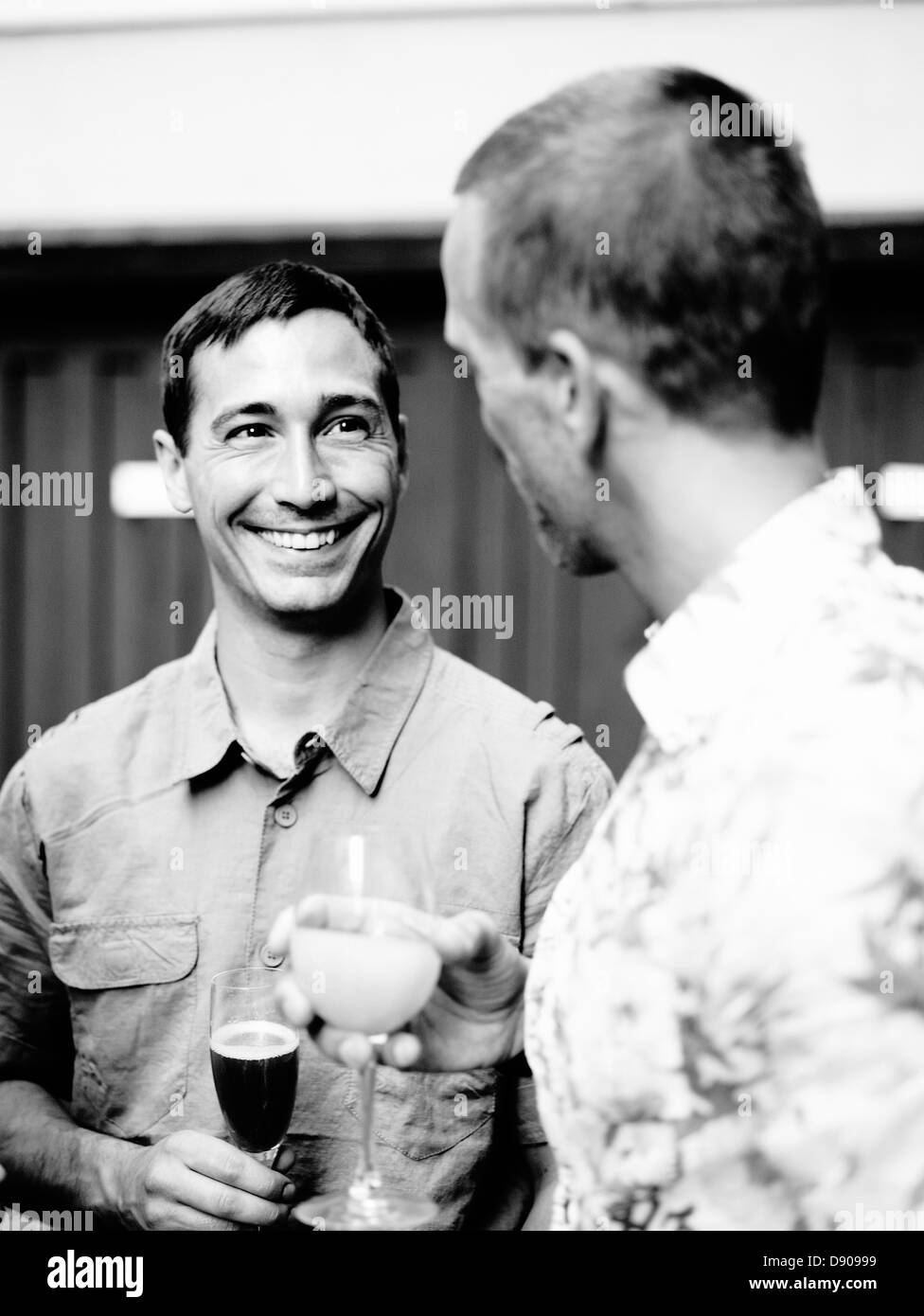 Men only together drinking Black and White Stock Photos & Images - Alamy