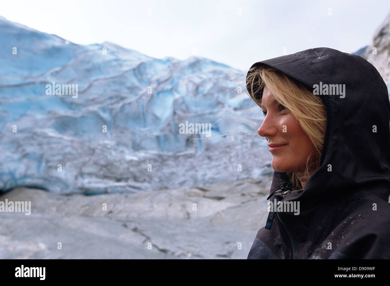 A woman by the glacier Jostedalsbreen in Norway Stock Photo - Alamy