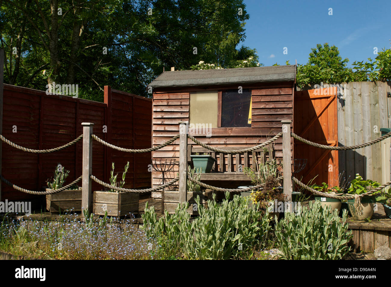shed on decking on sunny day in sunshine Stock Photo - Alamy