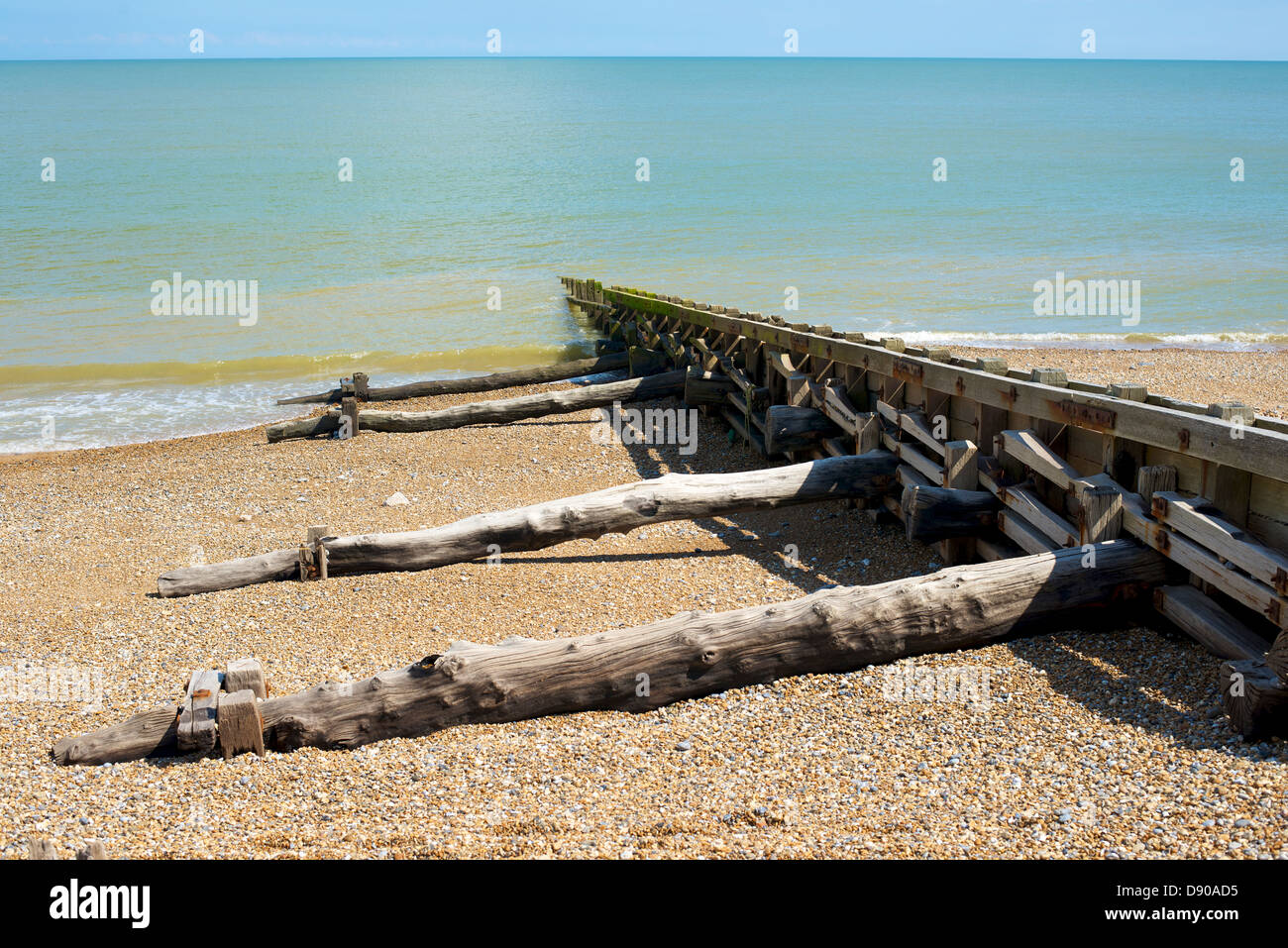 Skyline, shingle beach and wooden groyne at Pevensey, East Sussex Stock ...