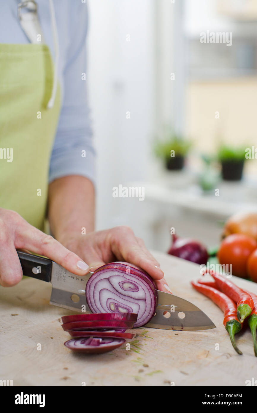 Woman cutting up vegetables, Sweden Stock Photo - Alamy