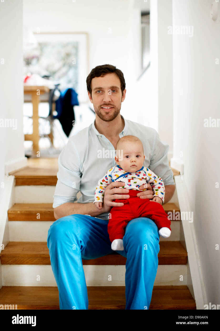 Father with baby on his knee hi-res stock photography and images - Alamy