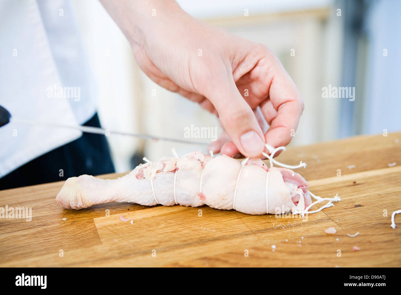 The leg of a chicken Stock Photo - Alamy