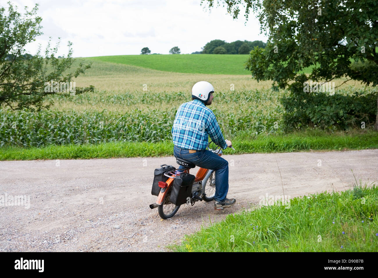 Person Riding Moped High Resolution Stock Photography and Images - Alamy