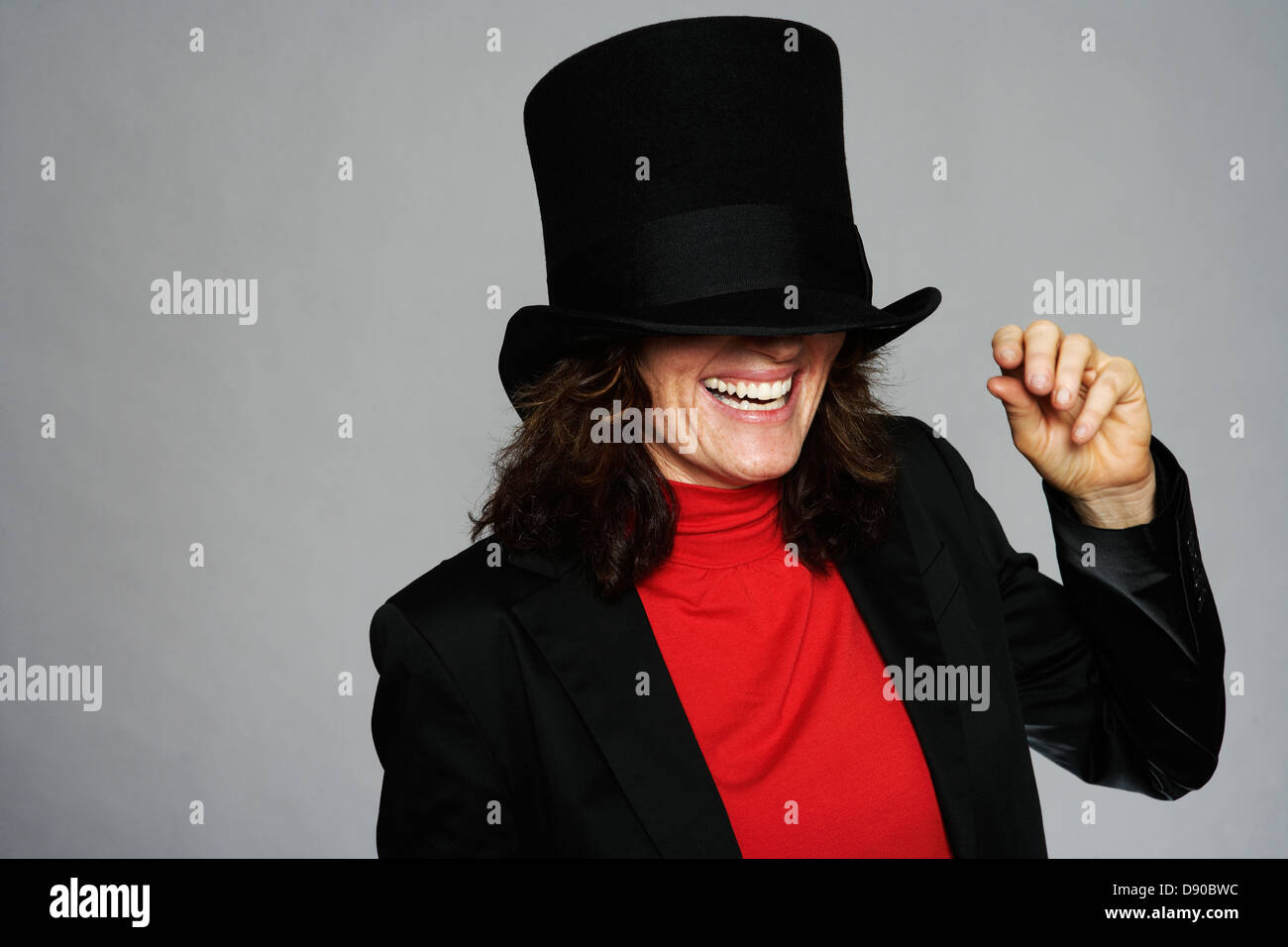 Portrait of a woman with a hat that is too big Stock Photo - Alamy