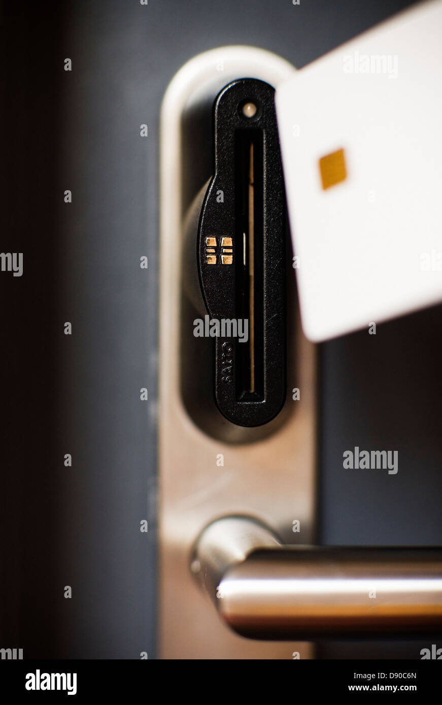 A door with a card key lock Stock Photo - Alamy