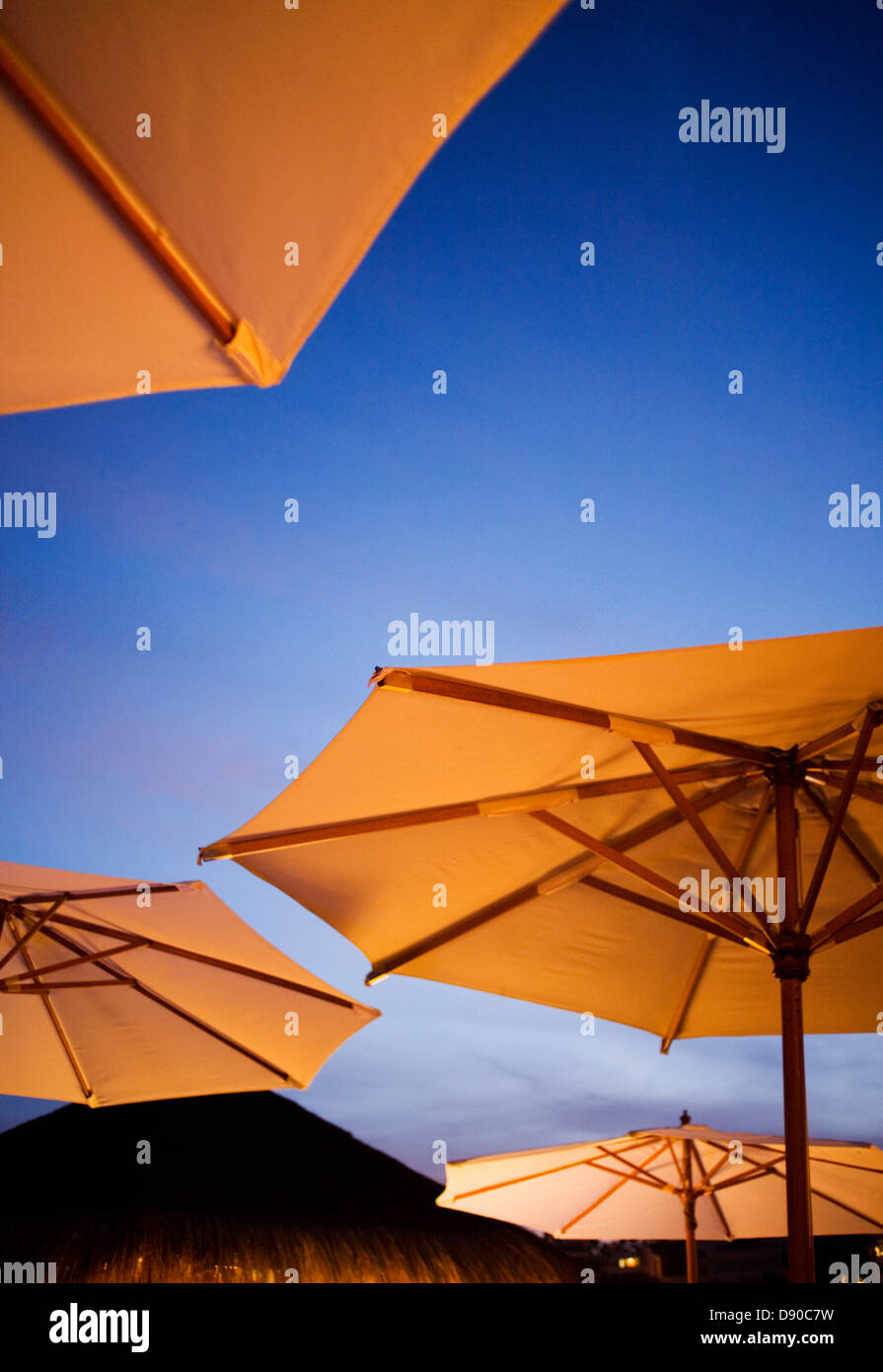Parasolls against an evening sky Stock Photo - Alamy