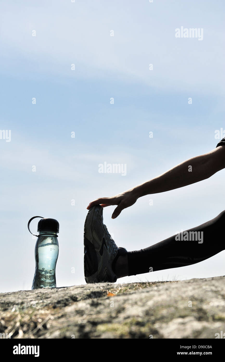 The leg of one person doing stretching exercises, Sweden Stock Photo ...