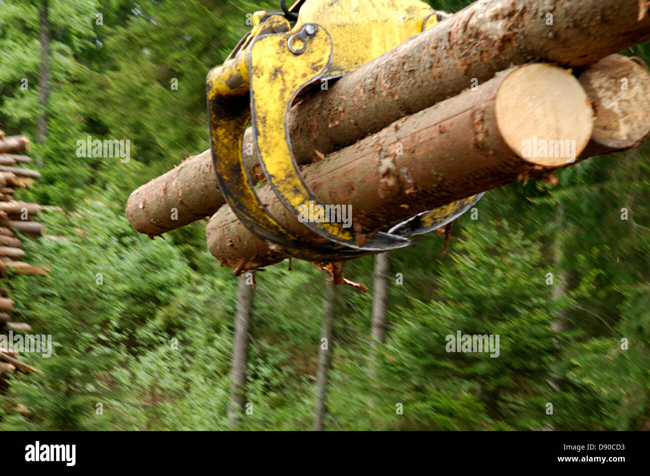 Excavator with timber Stock Photo - Alamy