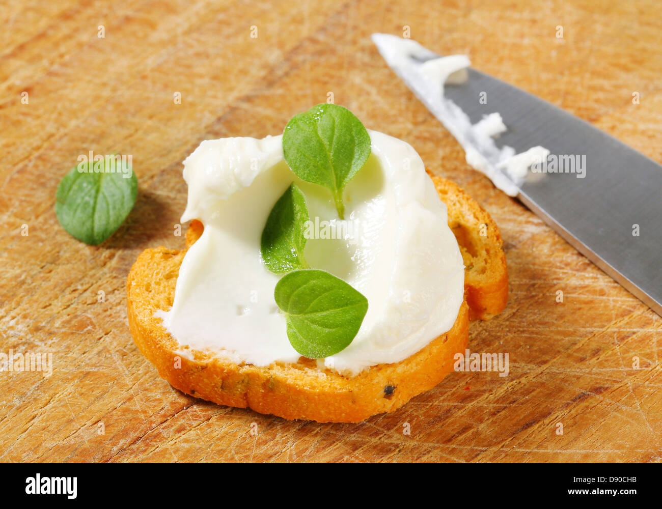 Small round toast with cheese spread Stock Photo - Alamy