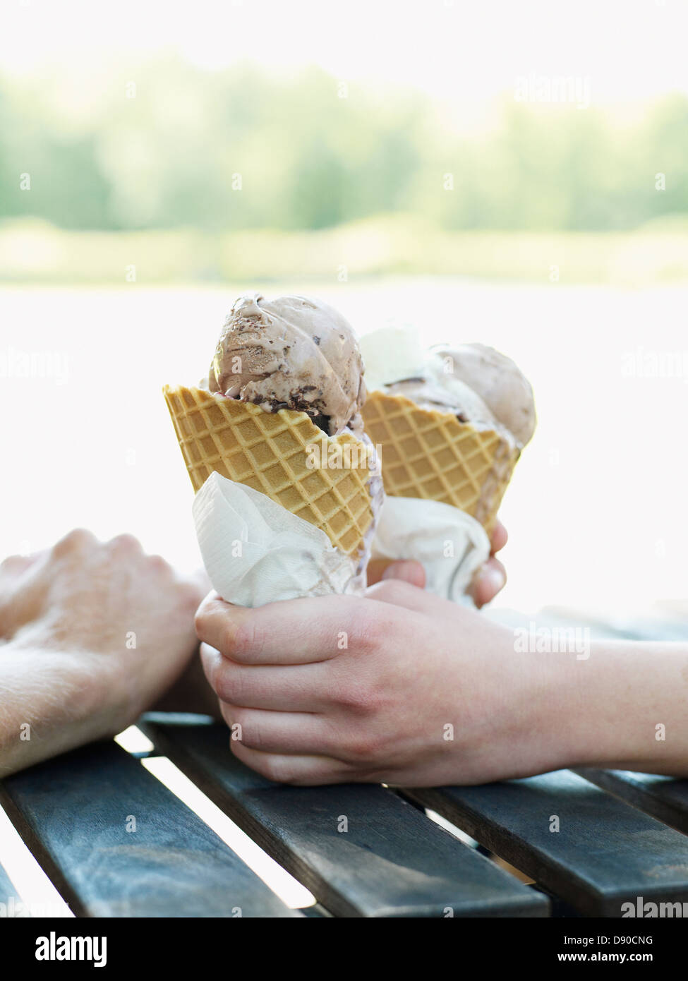Hands holding ice cream Stock Photo - Alamy