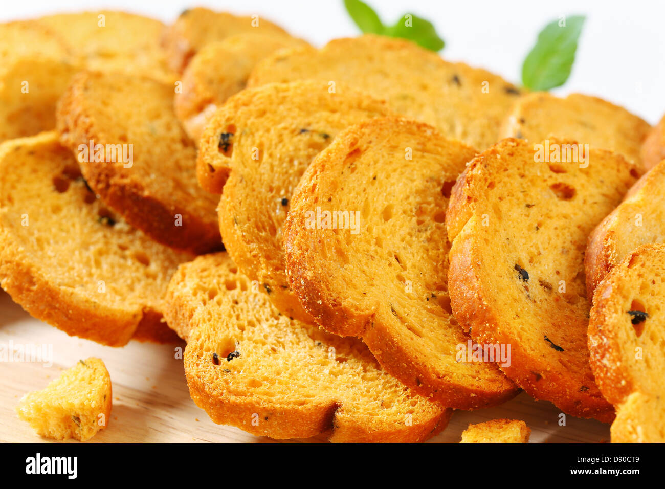 Small round toasts with black olives Stock Photo - Alamy
