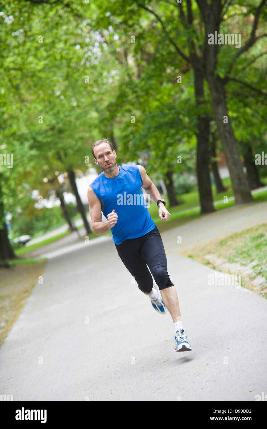 Man jogging in park Stock Photo - Alamy