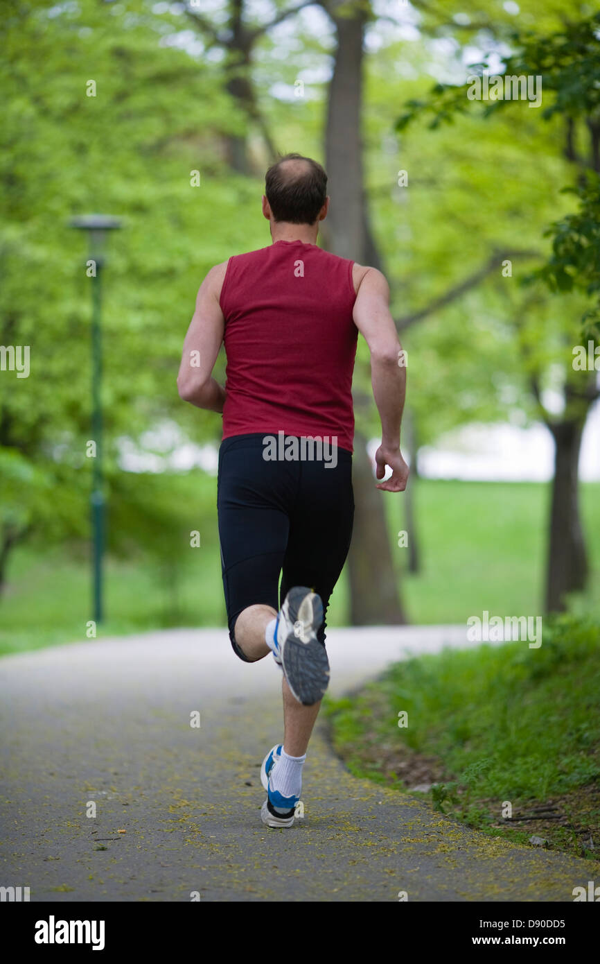 Man jogging in park Stock Photo - Alamy
