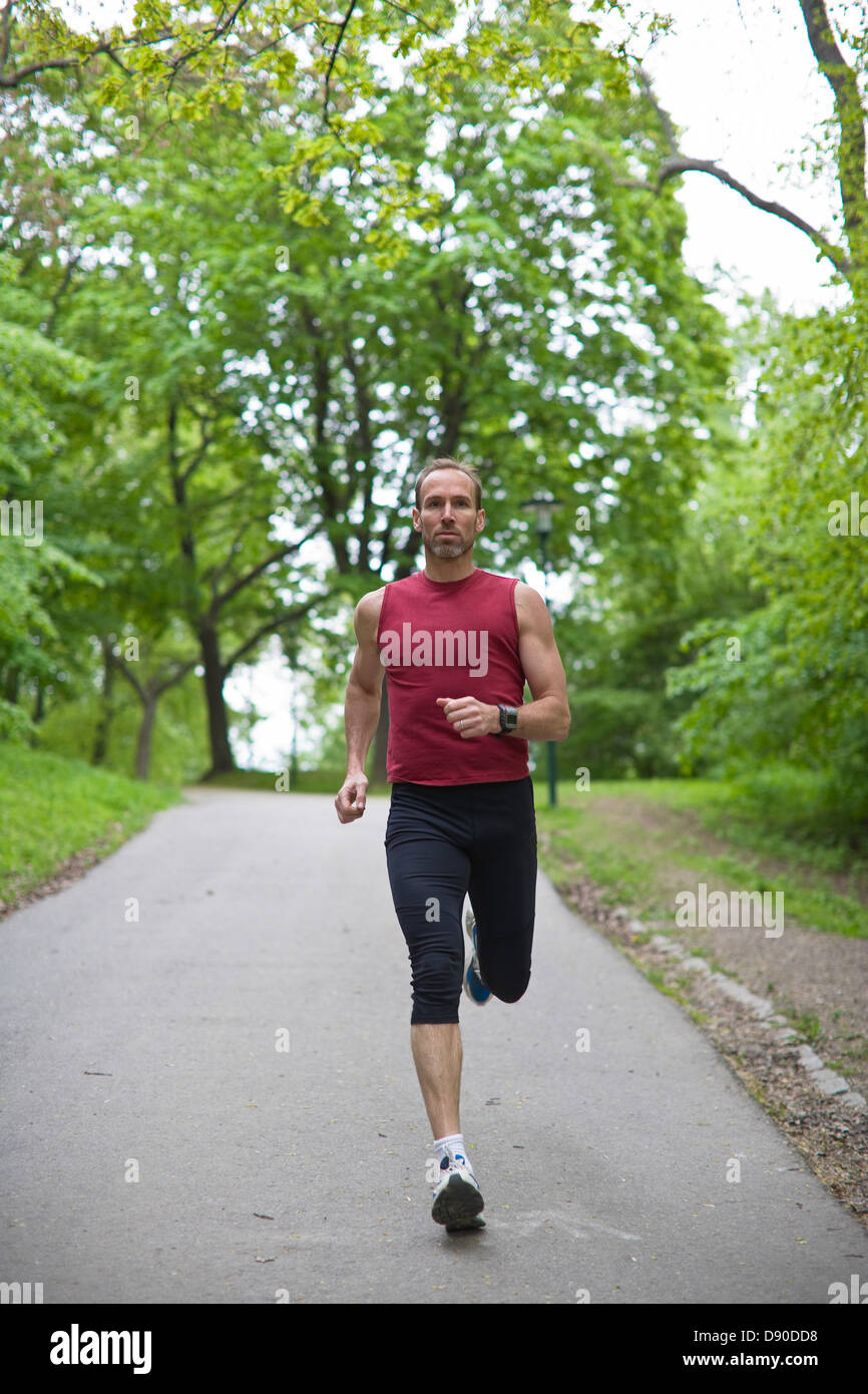 Man jogging in park Stock Photo - Alamy