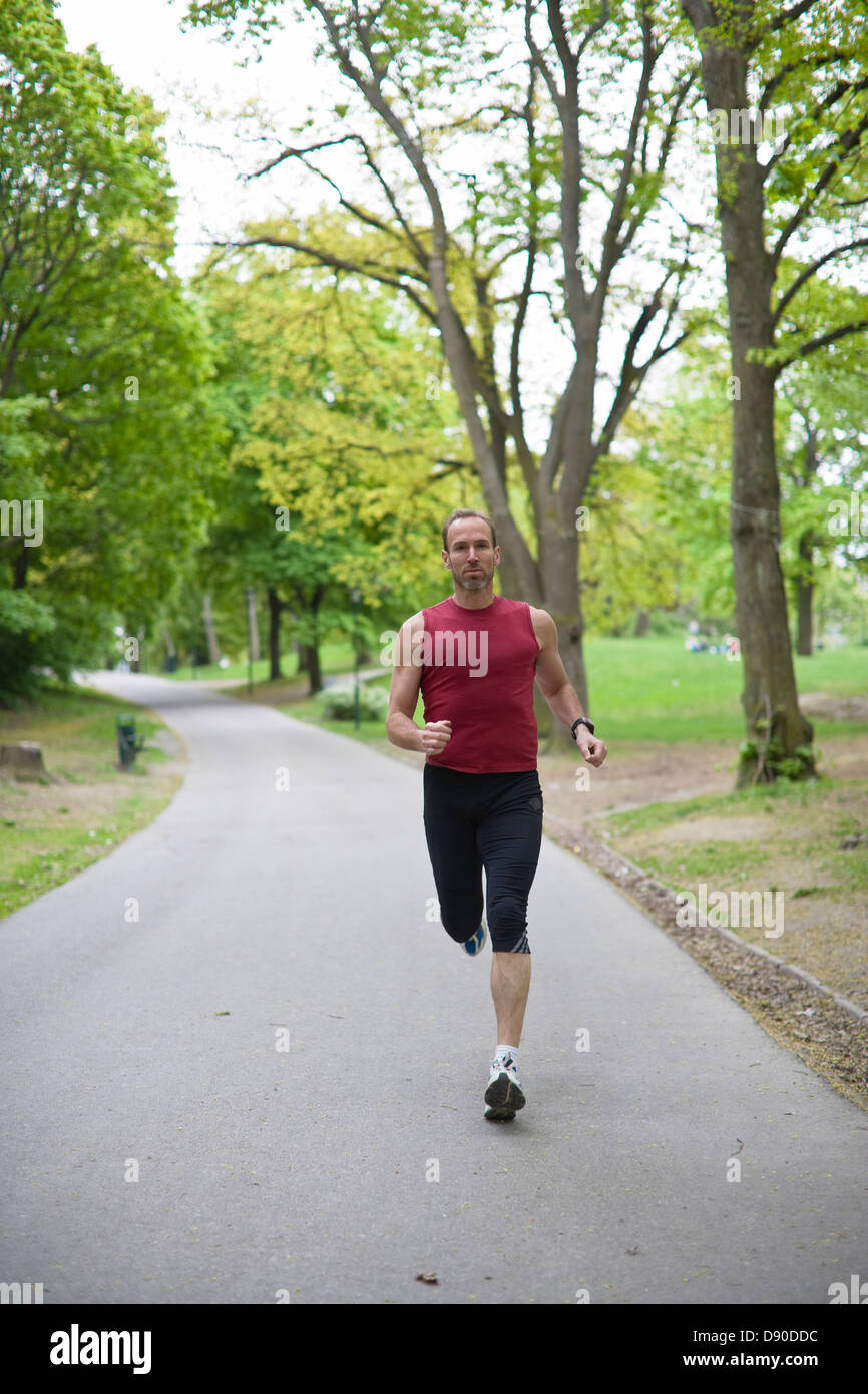Man jogging in park Stock Photo - Alamy