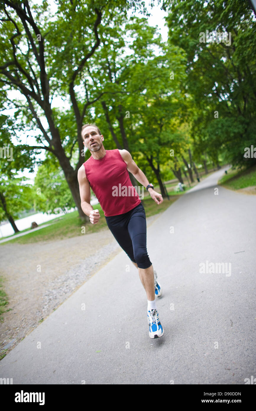 Man jogging in park Stock Photo - Alamy