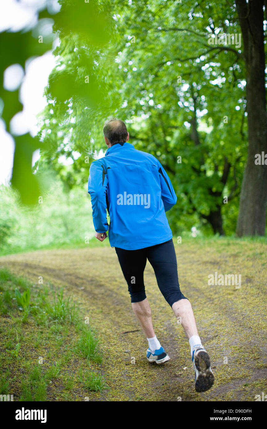 Man jogging in park Stock Photo - Alamy