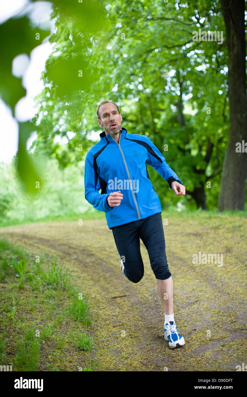 Man jogging in park Stock Photo - Alamy
