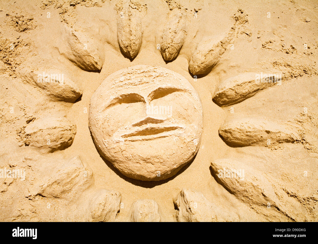 A sun in the sand on a beach Stock Photo - Alamy