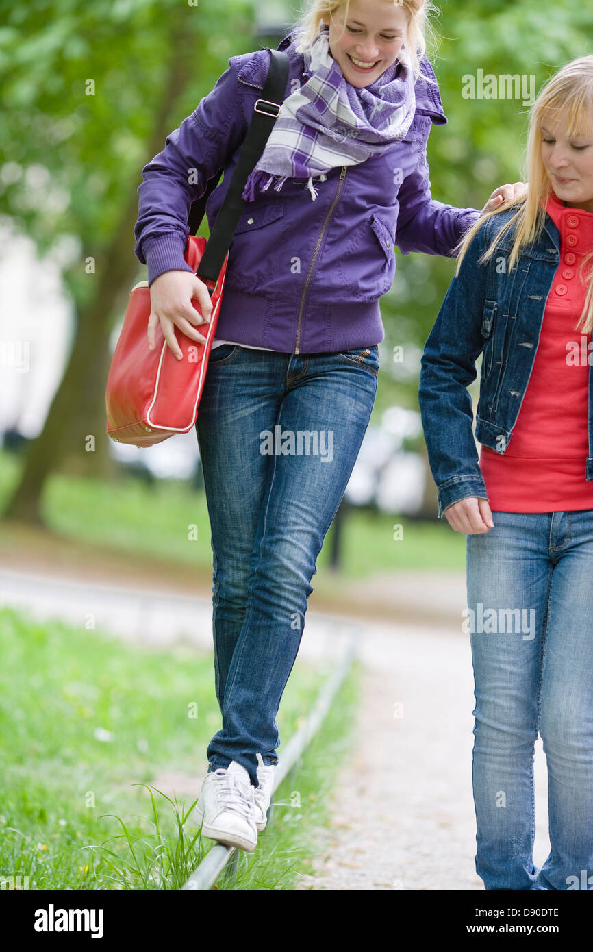 Two people walking through pathway hi-res stock photography and images ...