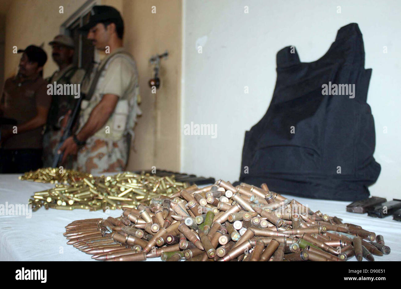 Rangers officials show weapons that recovered during a search operation ...