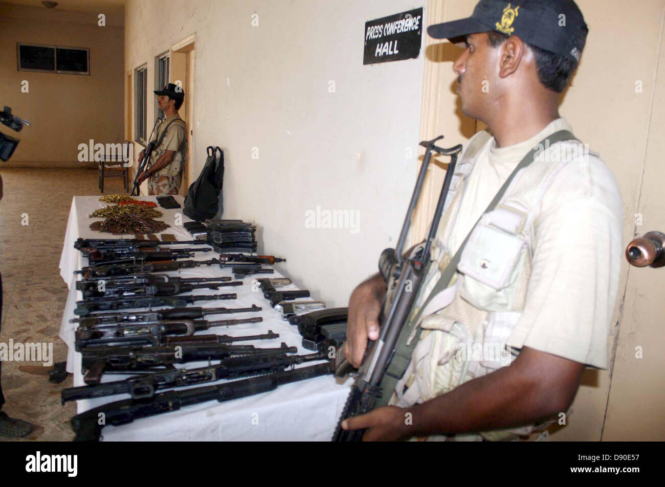 Rangers officials show weapons that recovered during a search operation ...