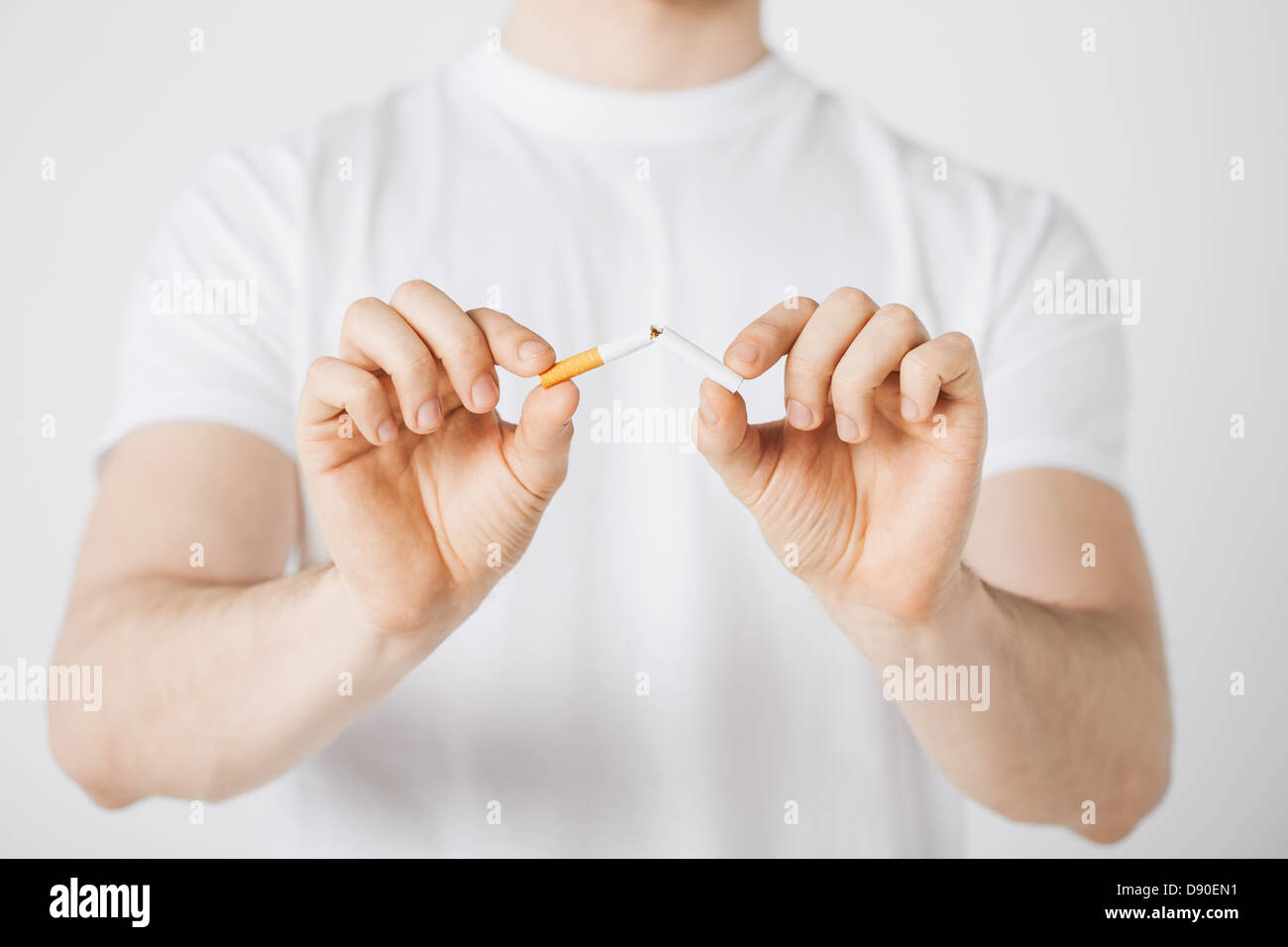 man breaking the cigarette with hands Stock Photo - Alamy