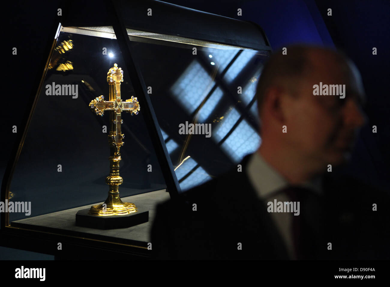 A man guards the Coronation Cross displayed in a showcase a day before ...