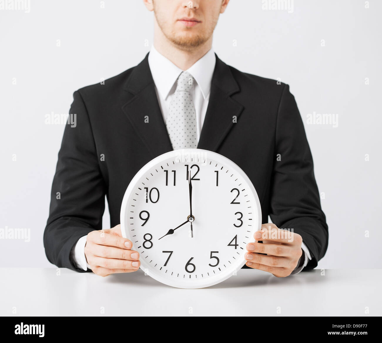 man with wall clock Stock Photo - Alamy