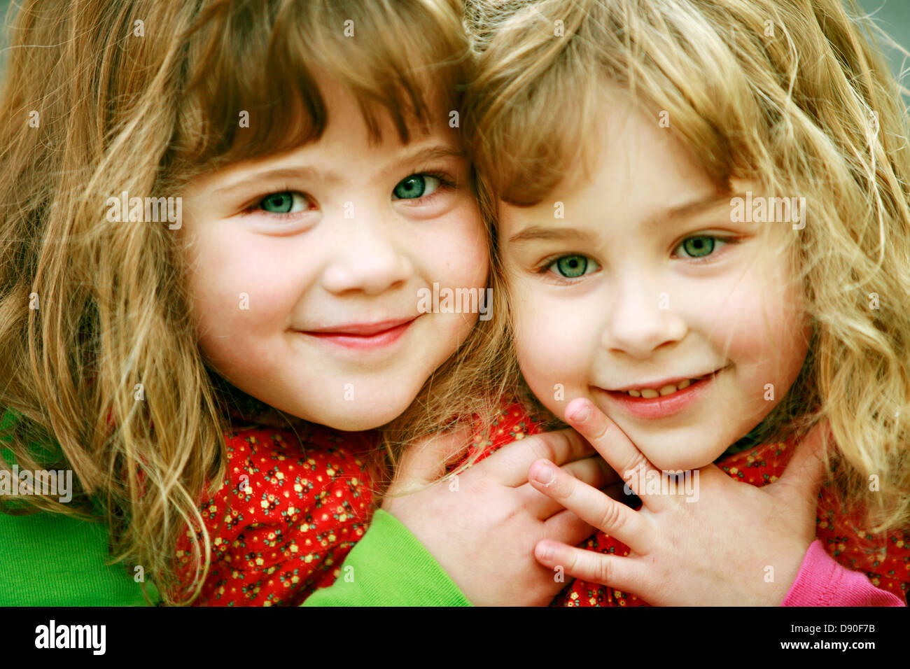 Portrait of two smiling girls Stock Photo - Alamy