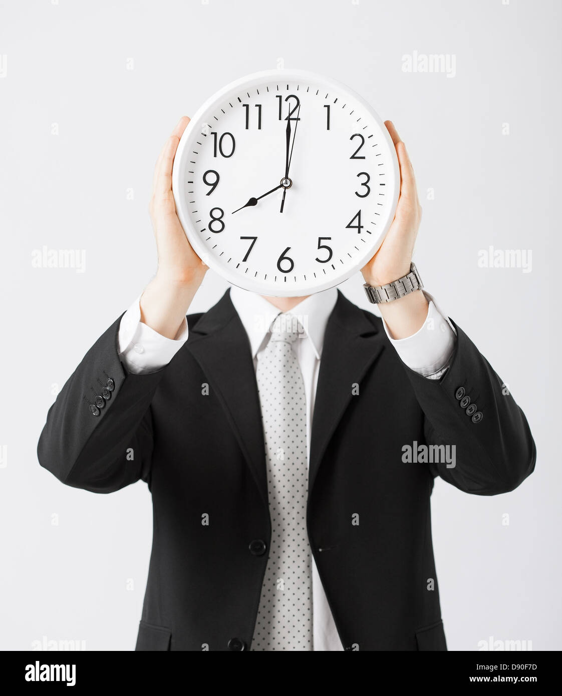 man with wall clock Stock Photo - Alamy