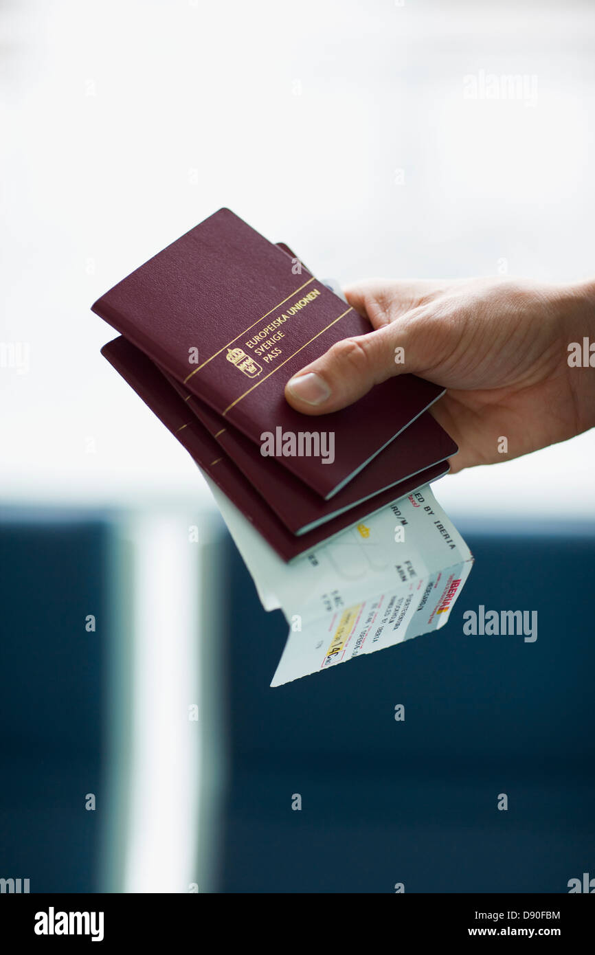 Swedish passports and flight tickets Stock Photo - Alamy