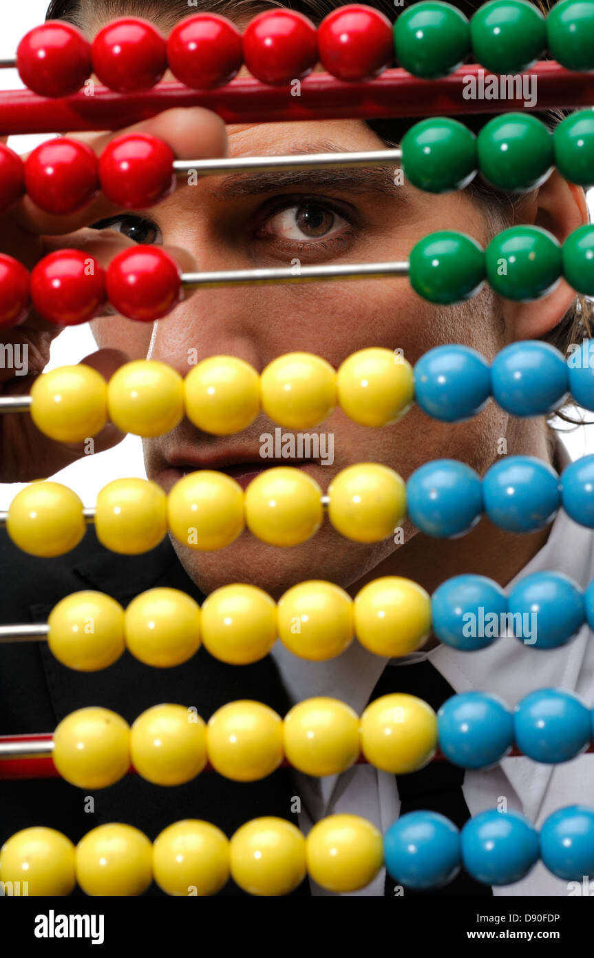 A man looking through an abacus, Sweden Stock Photo - Alamy