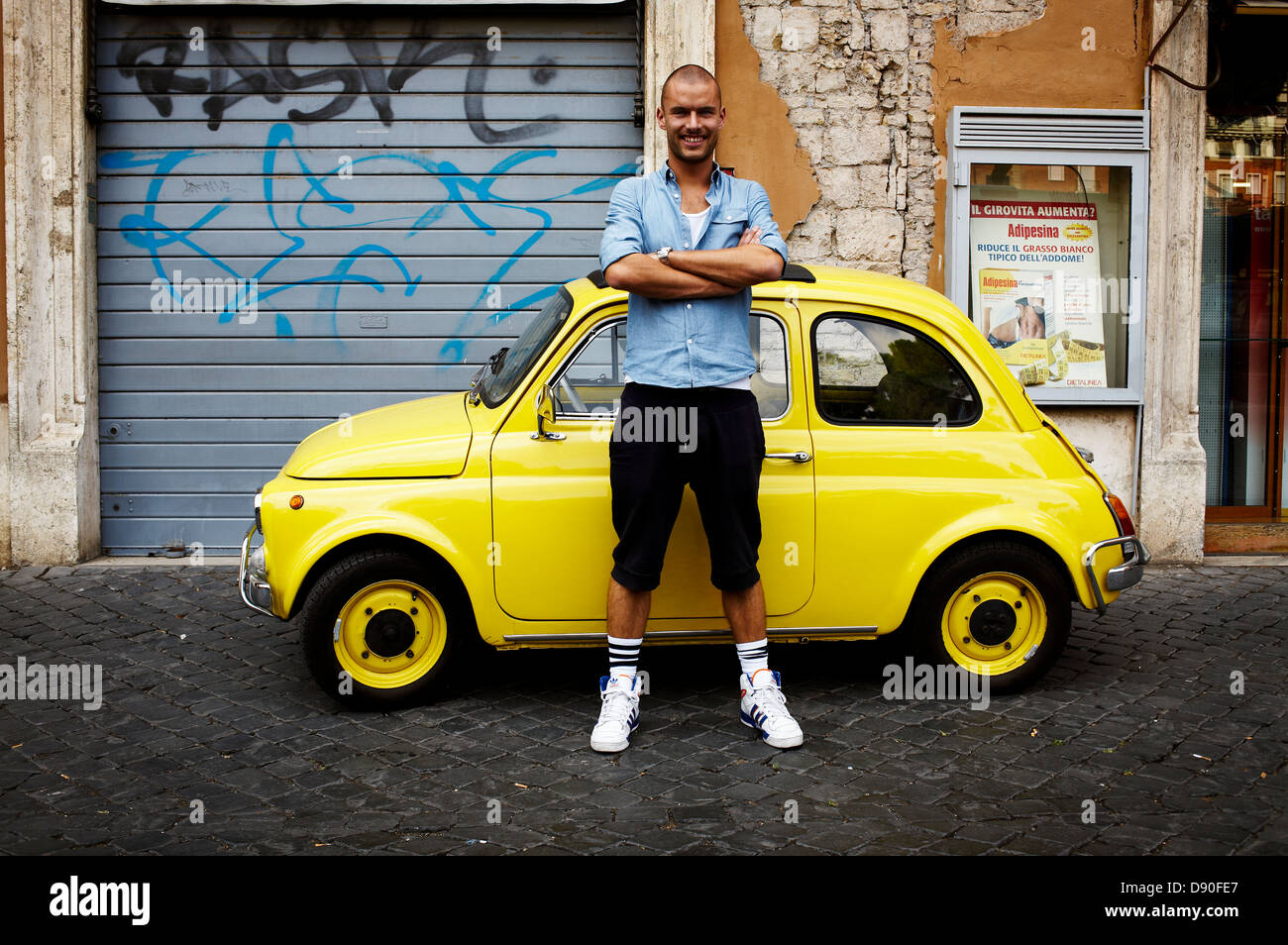 Man standing in front of car, smiling Stock Photo - Alamy