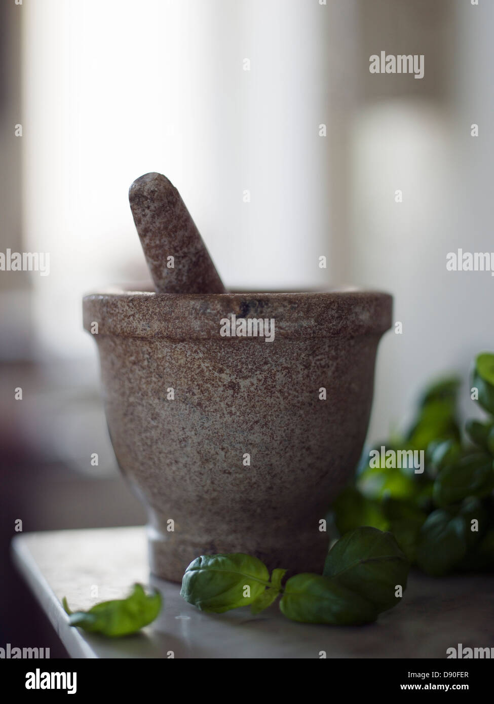 Pestle and mortar by basil, Sweden Stock Photo - Alamy