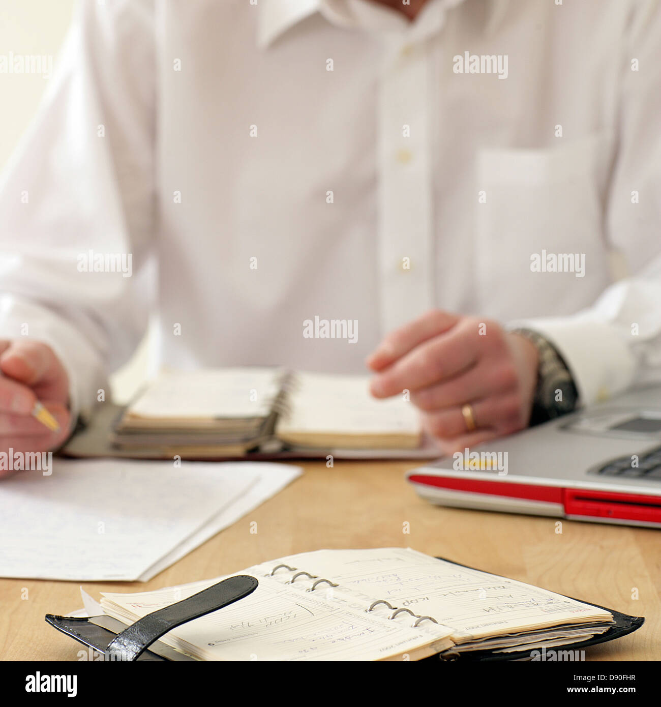 Scandinavian man sitting with his journals planning Stock Photo - Alamy
